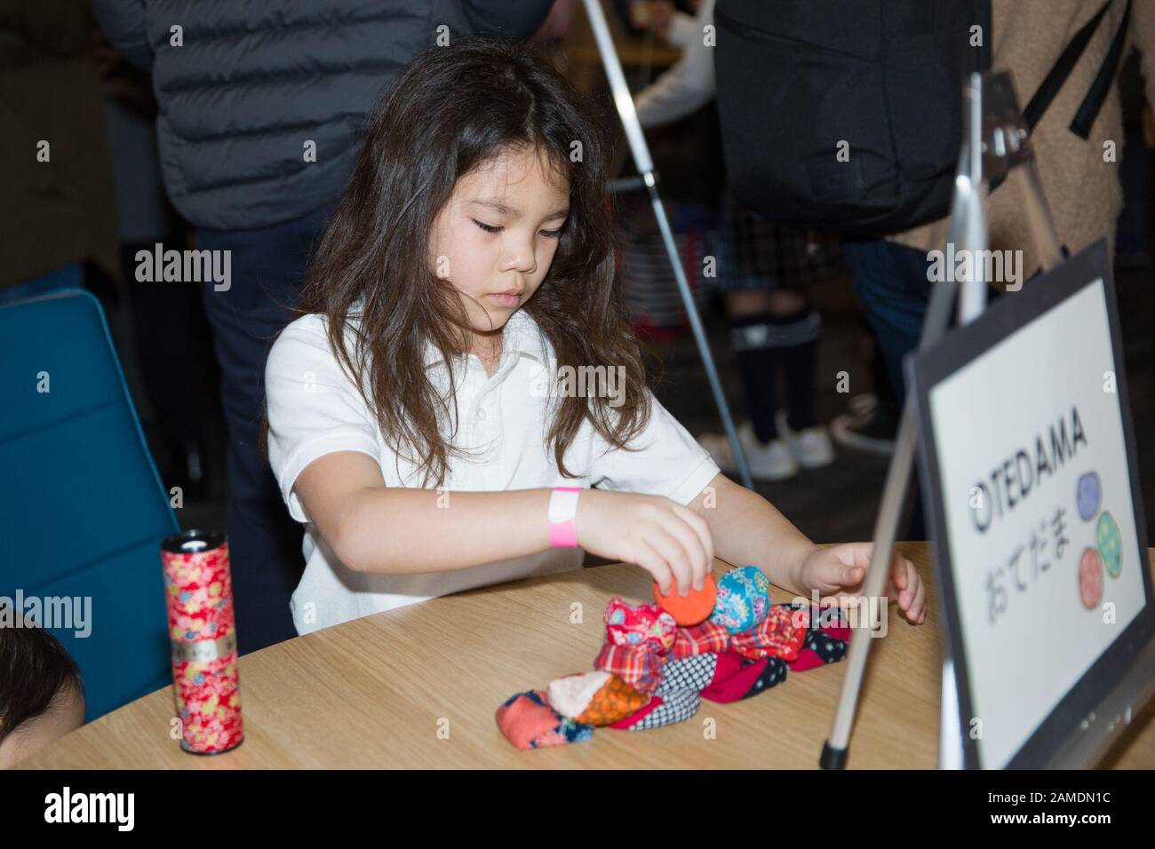 Dallas, USA. 12th Jan, 2020. A girl plays traditional Japanese beanbag ...
