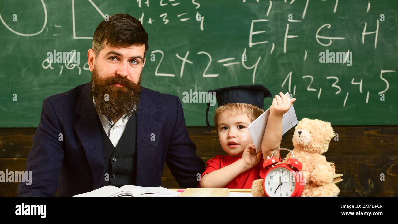 Father with beard, teacher teaches son, kid boy. Teacher and pupil in ...