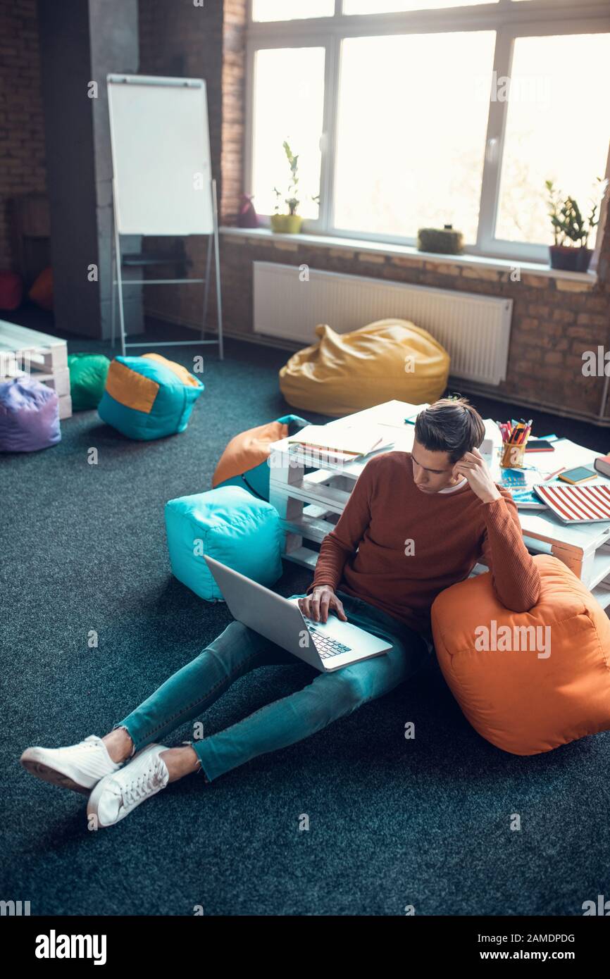 Top view of freelancer feeling thoughtful while having complicated task ...