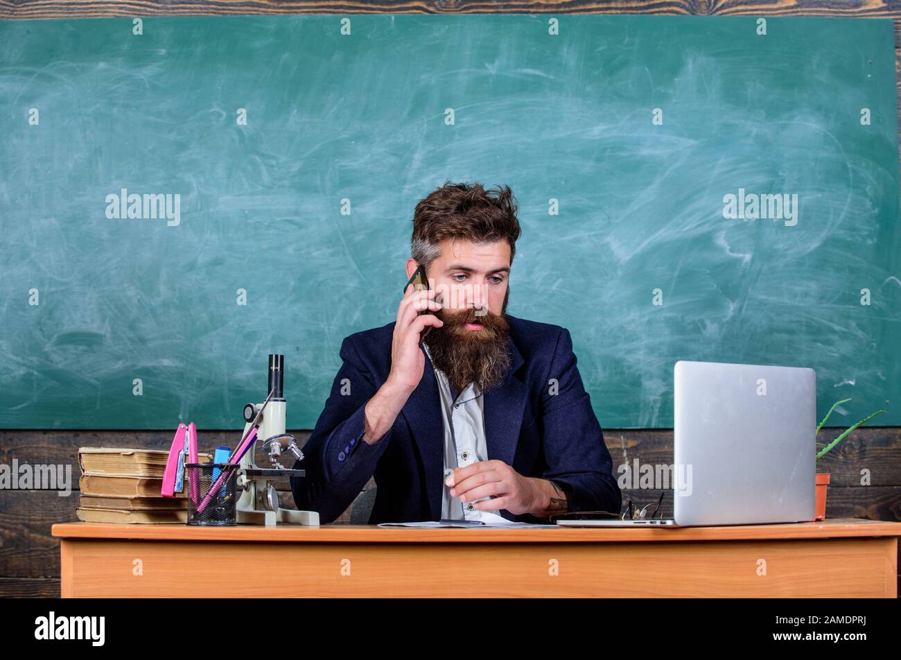 School principal or teacher calling parents to report about exam ...