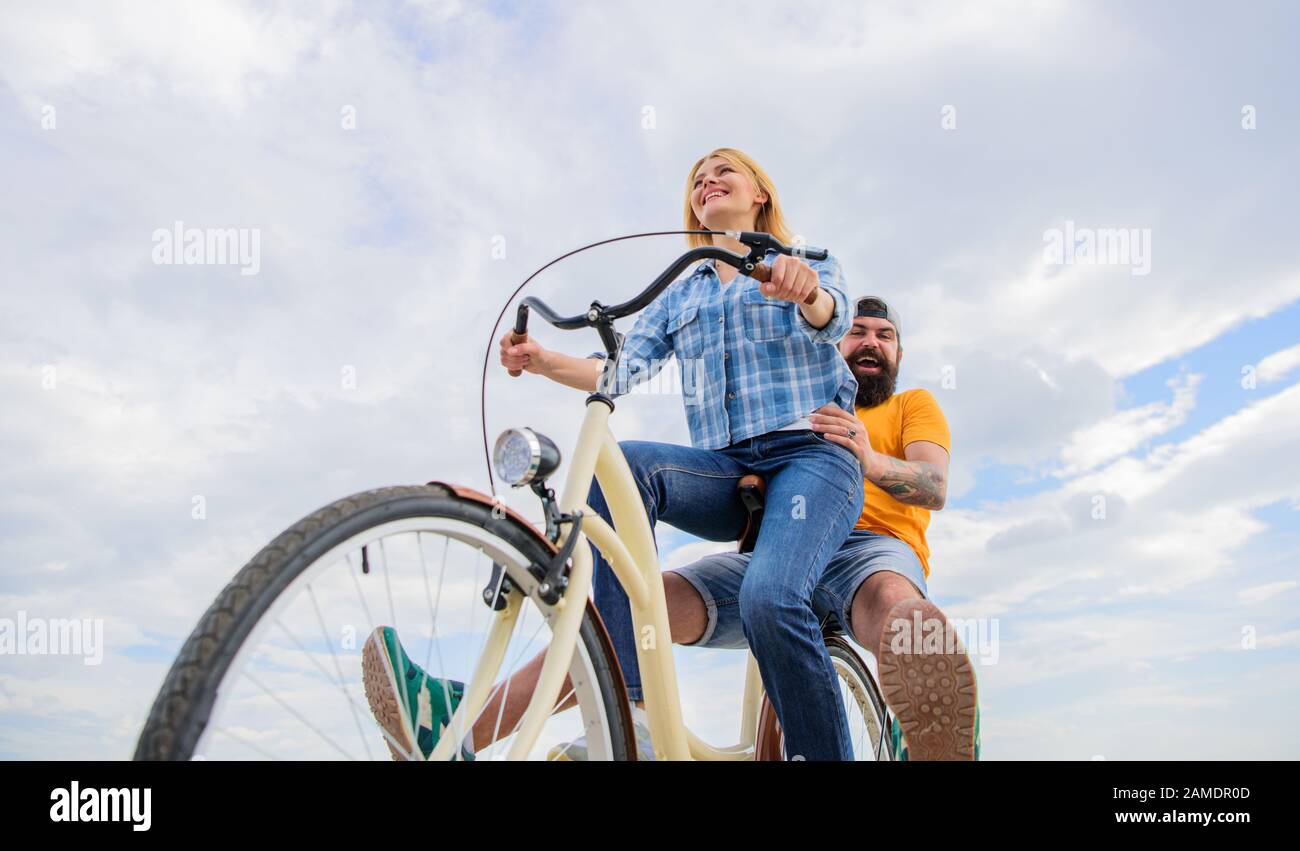 Youth have fun riding bike sky background. Enjoy summer holidays ...