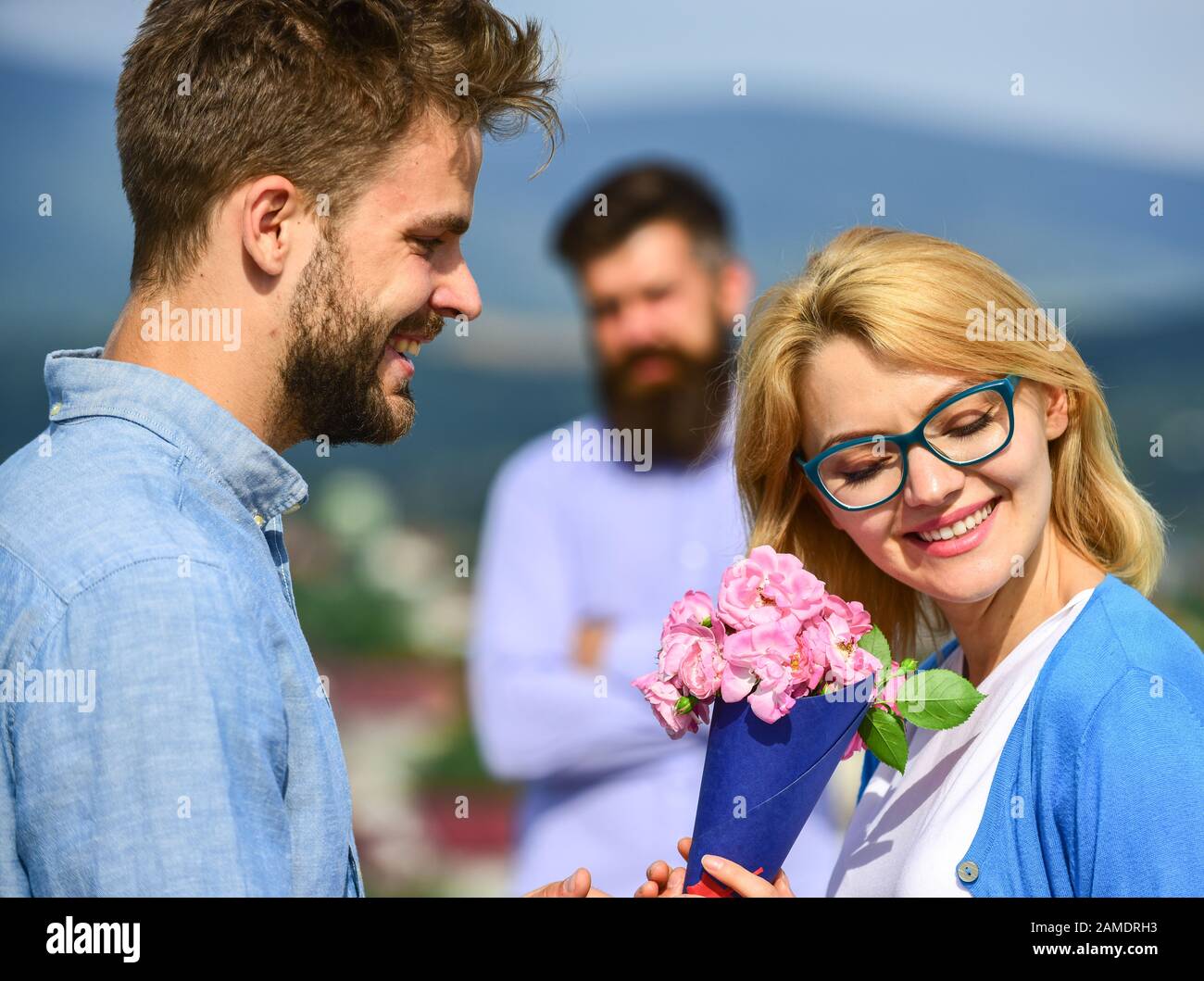 Couple in love dating while jealous husband fixedly watching on ...