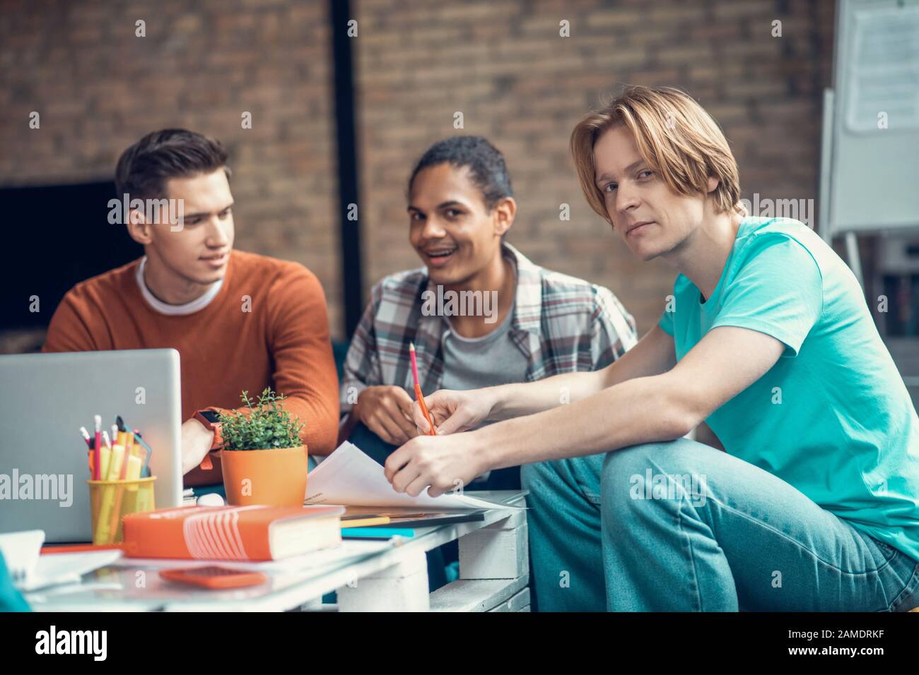 Smart students feeling involved into preparation for exam Stock Photo ...