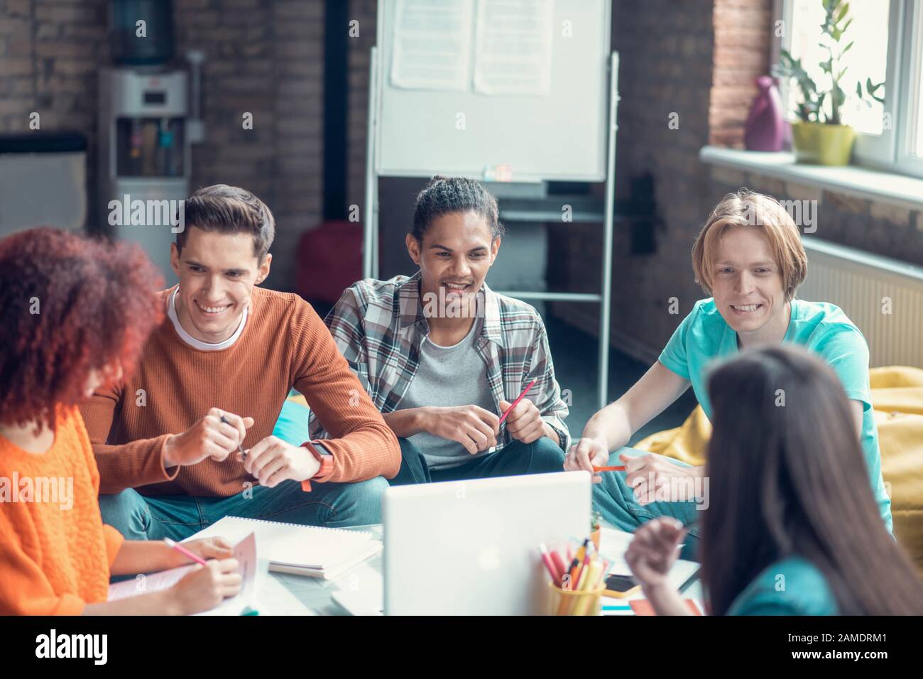 Cheerful students having group discussion after watching webinar Stock ...
