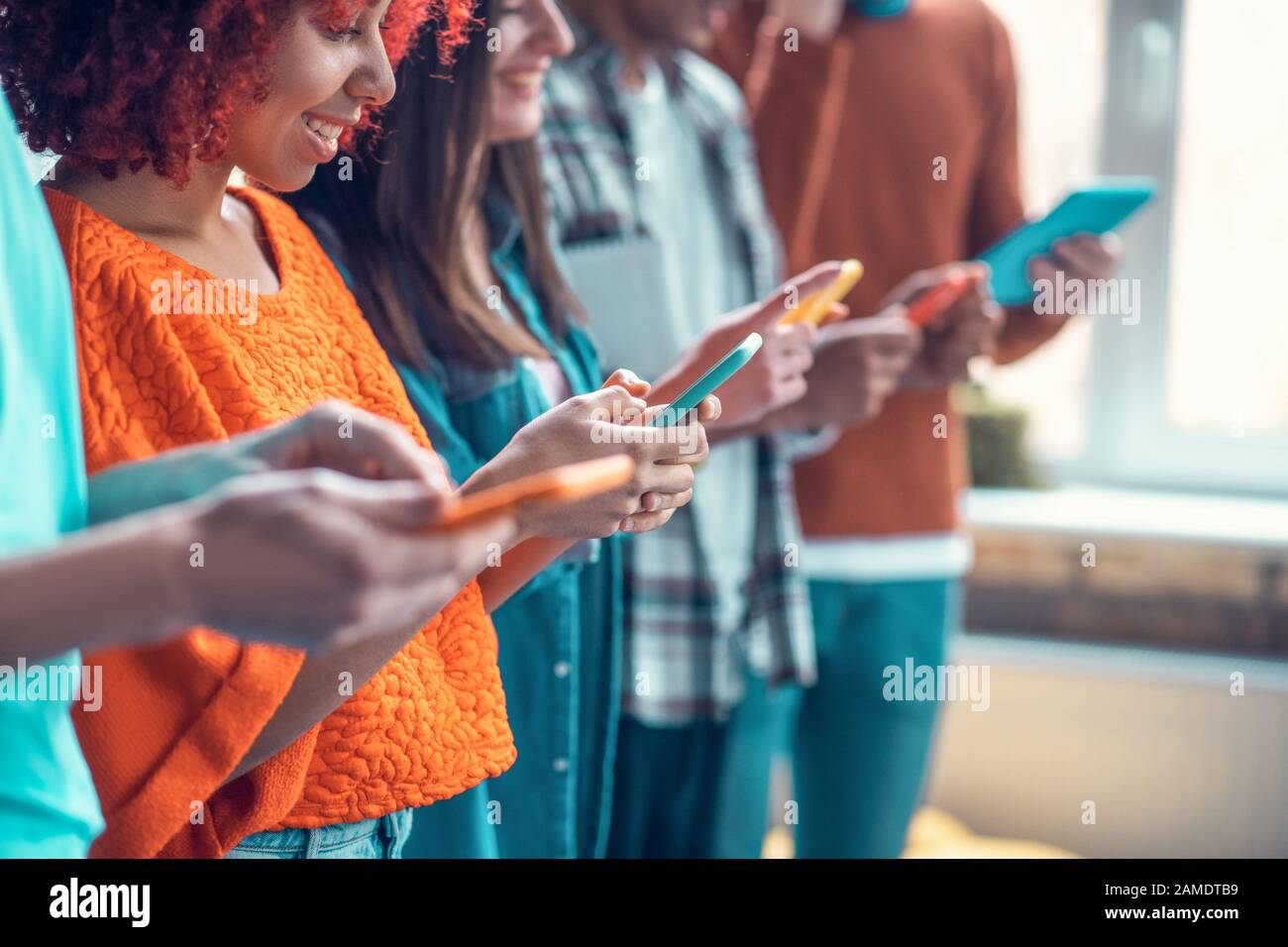 Students using their devices while having addiction to social media ...