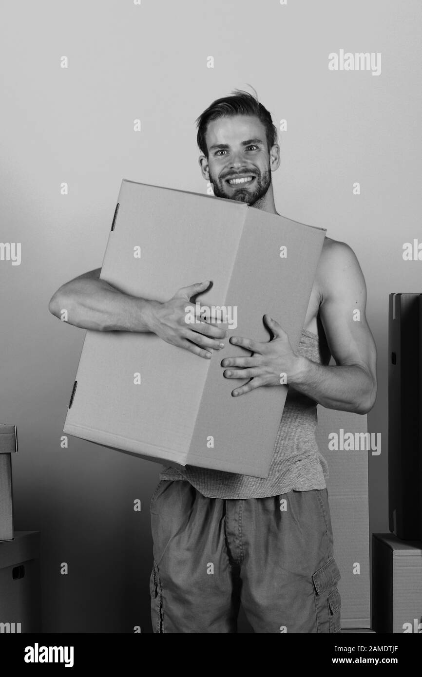 Happy man packing boxes Black and White Stock Photos & Images - Alamy