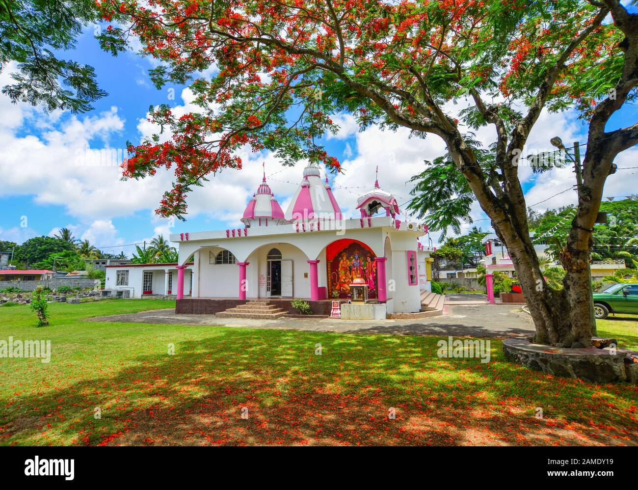 Le Morne, Mauritius - Jan 4, 2017. Local temple with flamboyant tree in ...