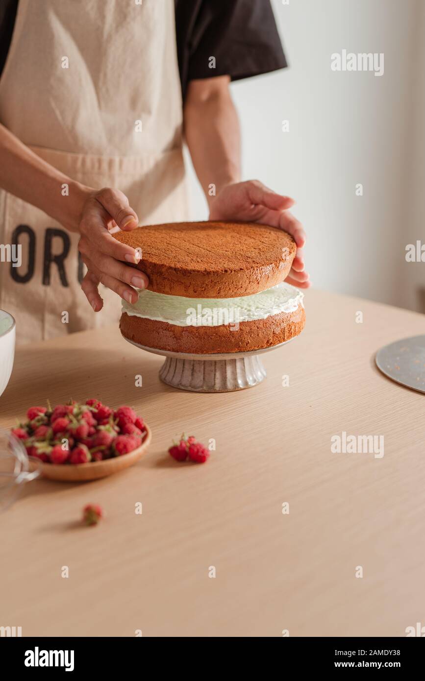 Process making cake woman puts hi-res stock photography and images - Alamy