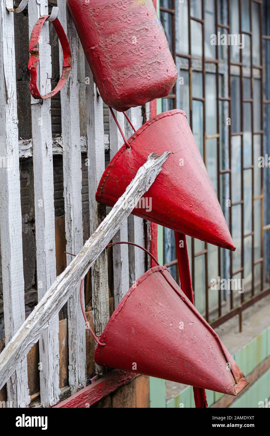 Wall mounted fire shield with fire fighting tools. Cone buckets and ...