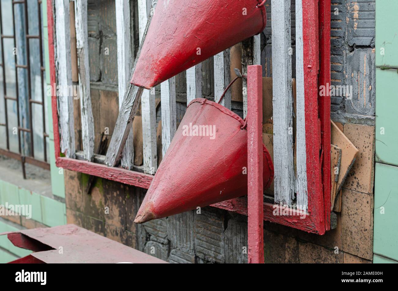 Two cone buckets hang on a fire shield. Side view of an old fire shield ...