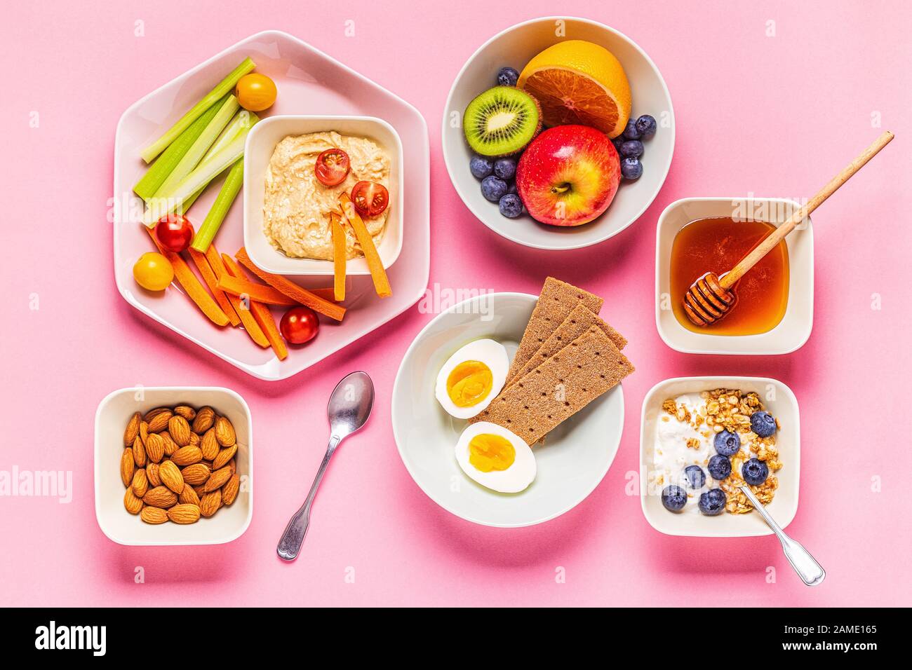 Healthy snack on a pastel background, top view Stock Photo - Alamy