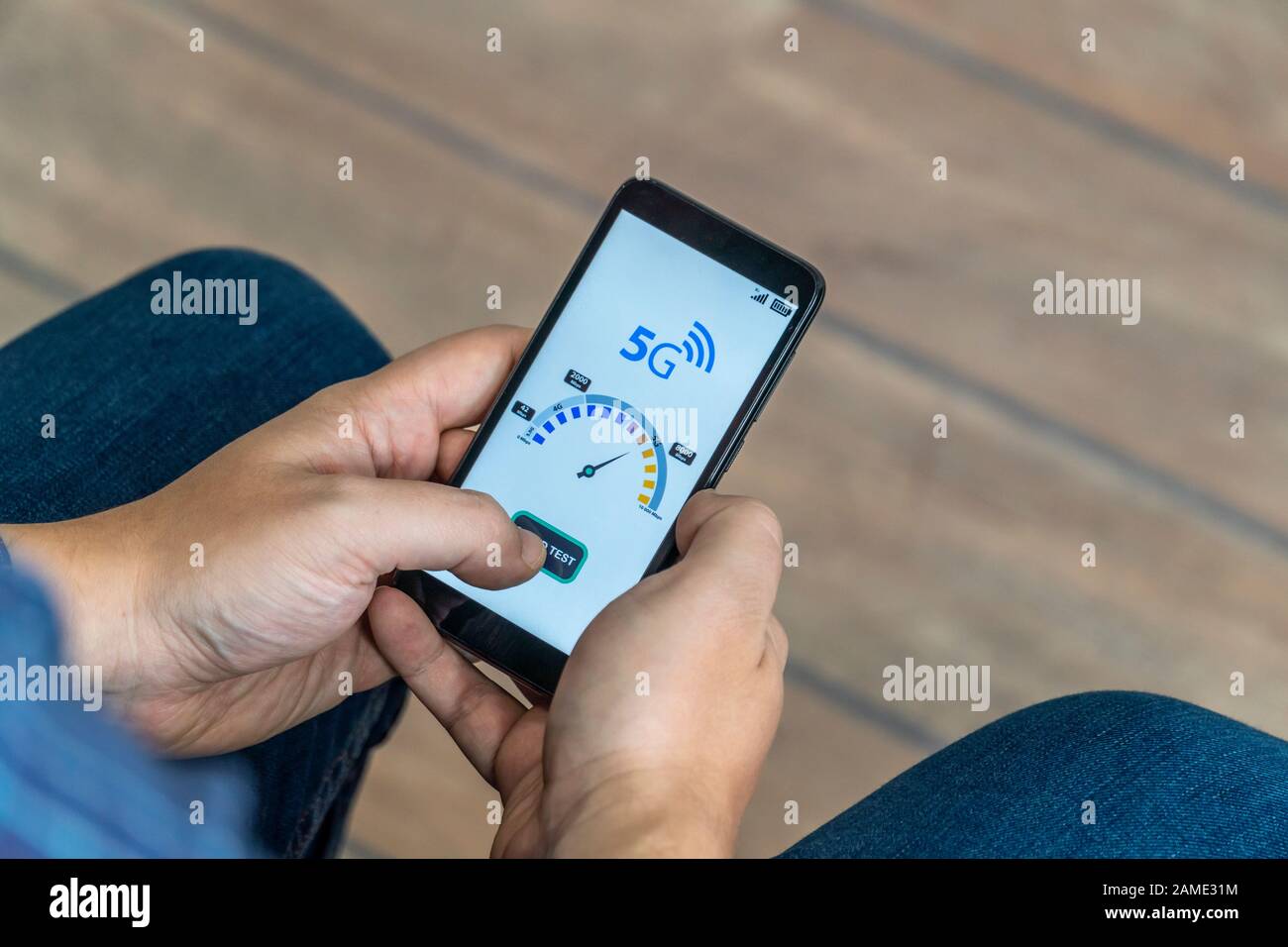 5g network speed concept. Man checking his smartphone on 5g network and ...