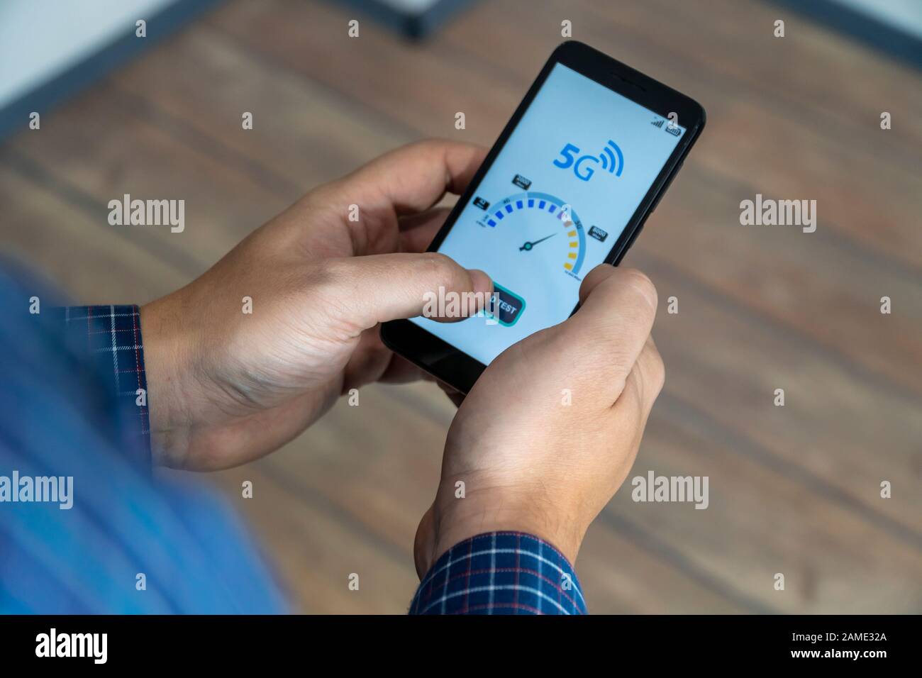 5g network speed concept. Man checking his smartphone on 5g network and ...