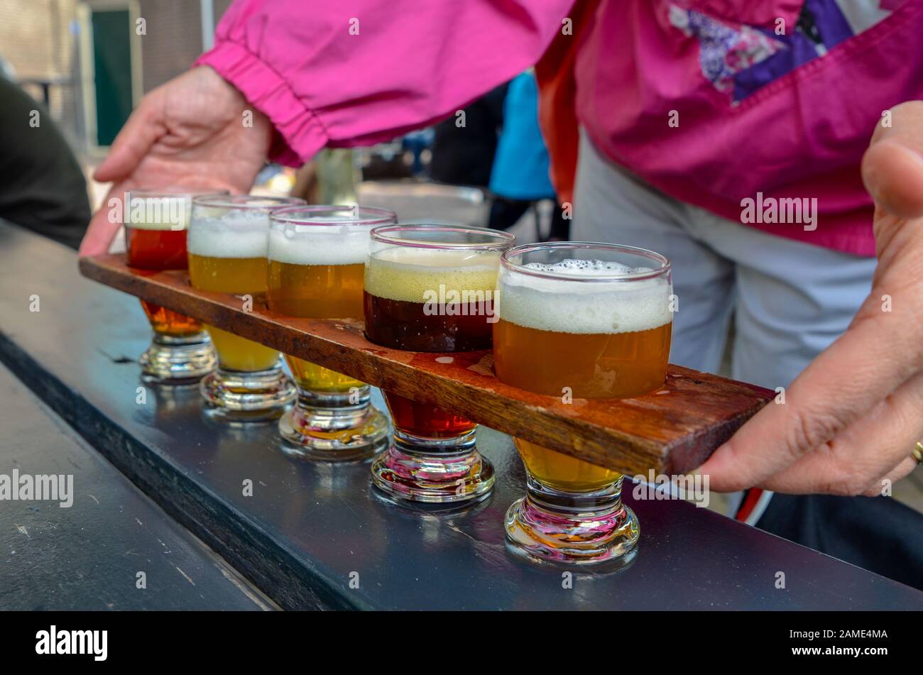 Craft beer tasting: five glasses with beers of different colors and ...