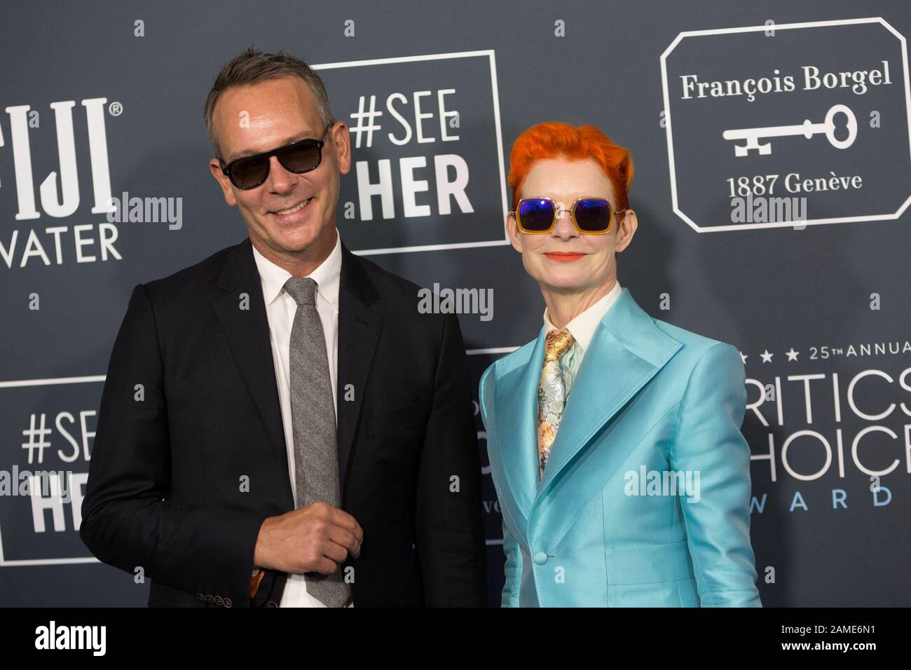 Christopher Peterson and Sandy Powell (r) attend the 25th Annual ...