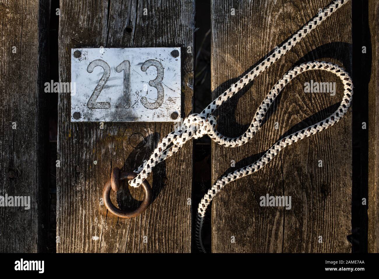 a metal board with the number two hundred and thirty and a place to ...