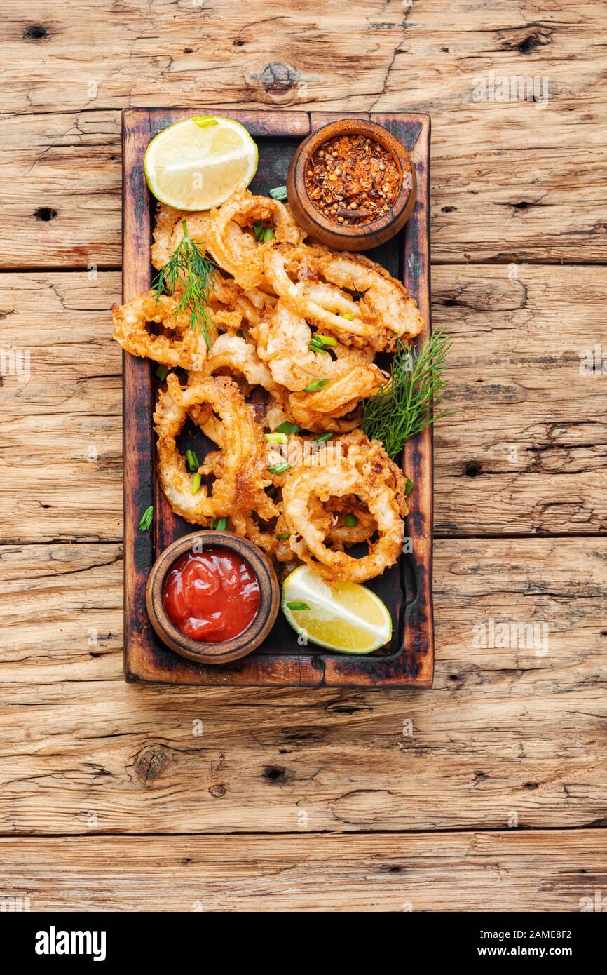 Crunchy deep fried squid rings in batter Stock Photo - Alamy
