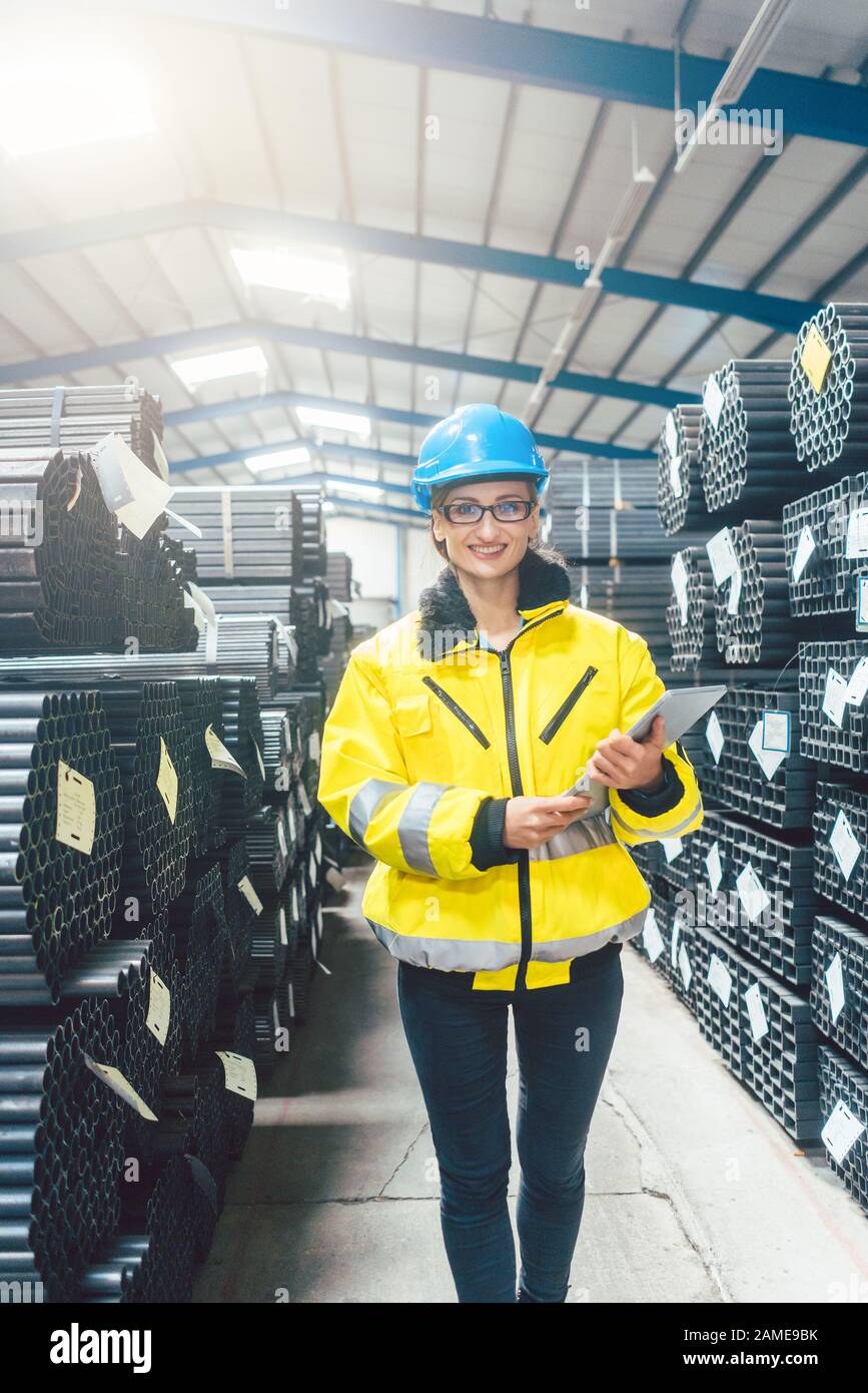 Woman working in logistics warehouse Stock Photo - Alamy