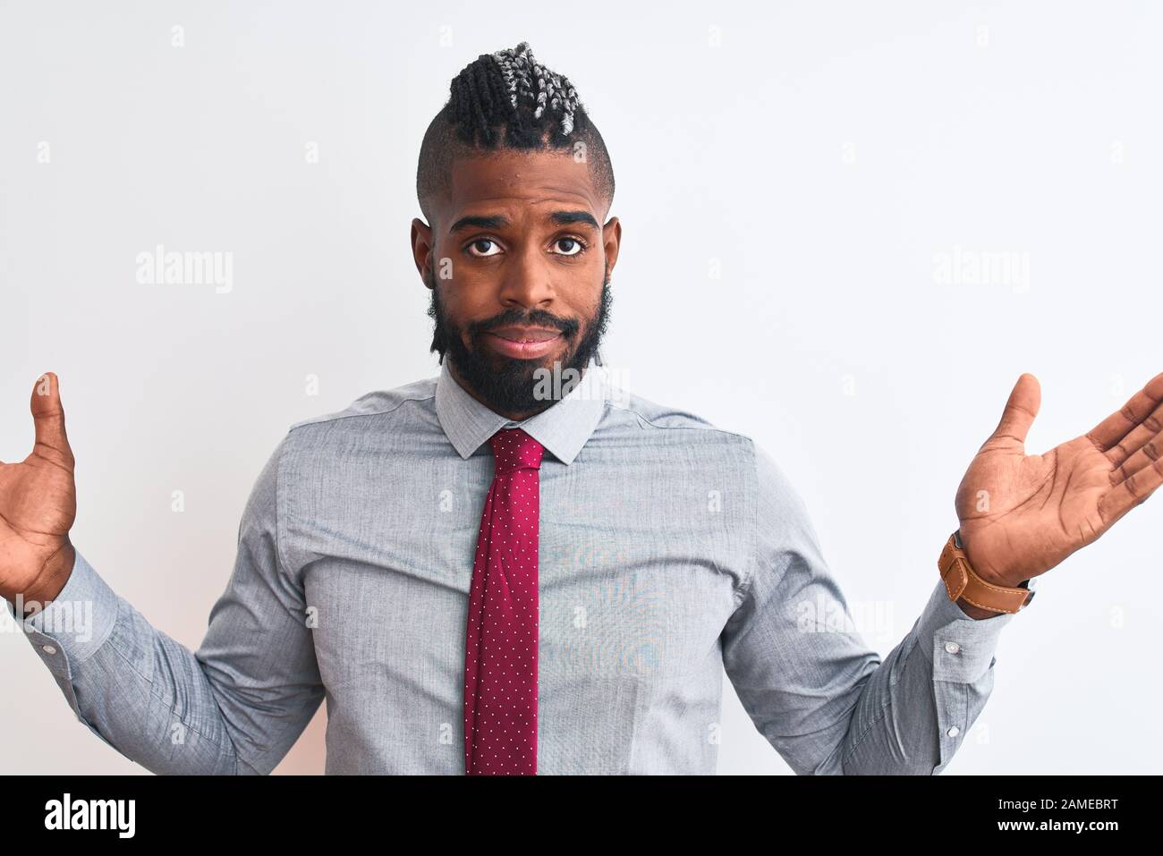 African american businessman with braids wearing tie standing over ...