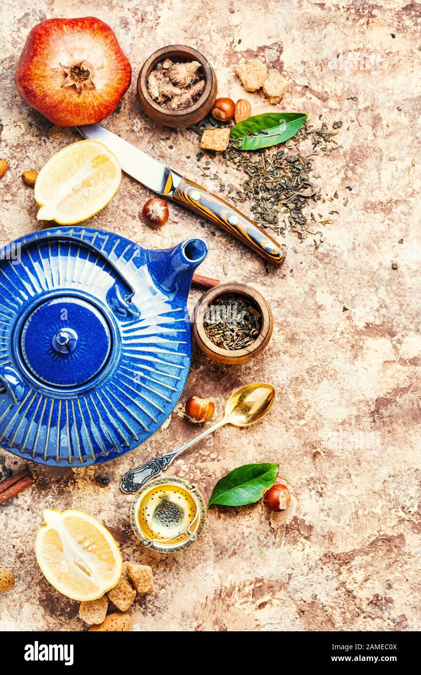 Natural ingredients for tea.Porcelain blue teakettle.Useful tea with ...