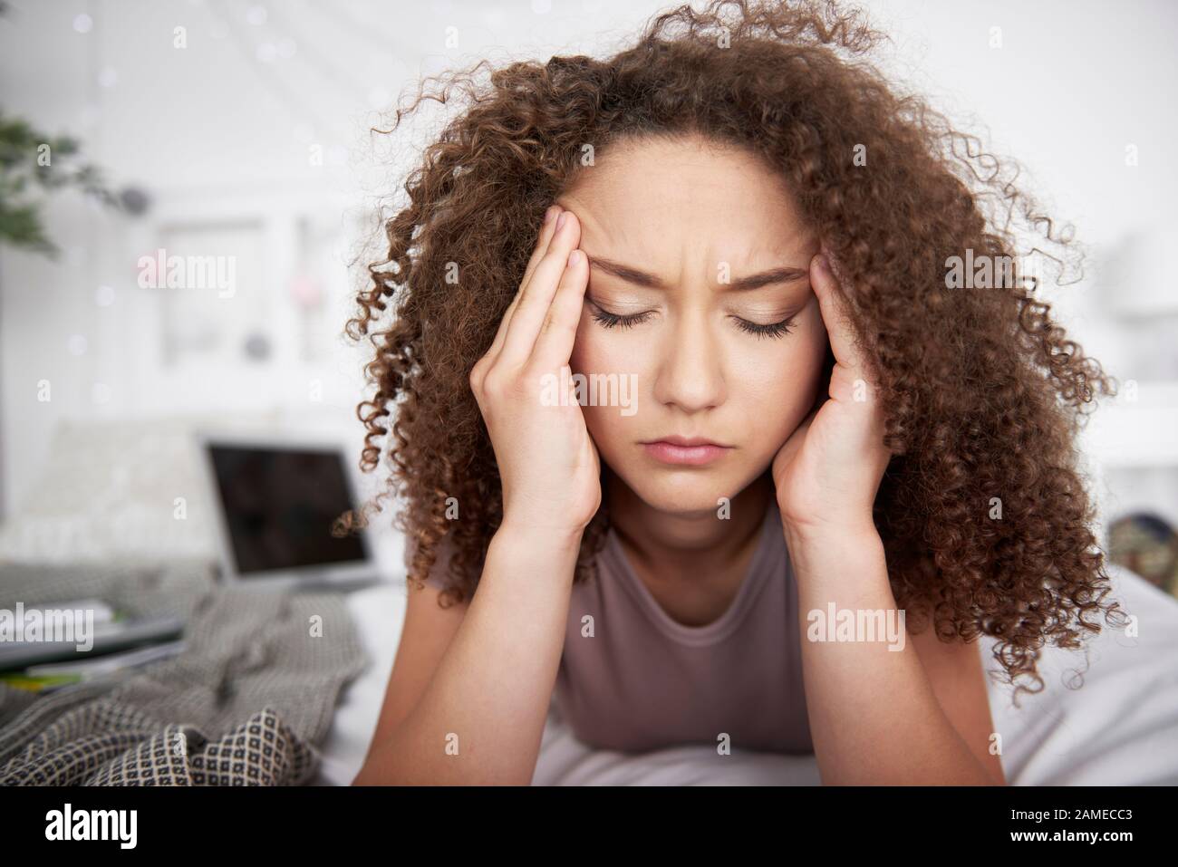 Young woman has a bad head Stock Photo - Alamy