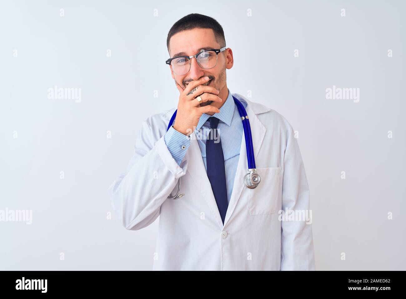 Young doctor man wearing stethoscope over isolated background laughing ...