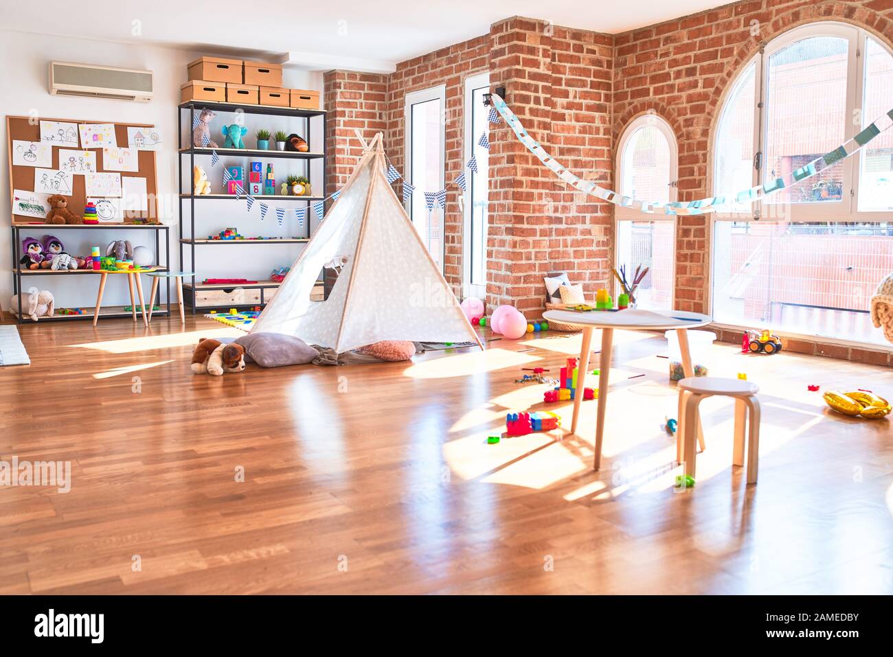 Picture of preschool playroom with colorful furniture and toys around ...
