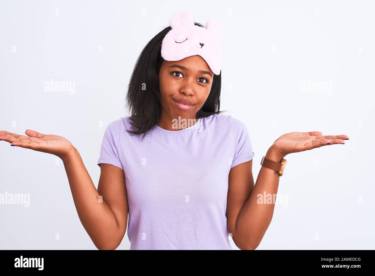 Young african american woman wearing sleeping mask over isolated ...