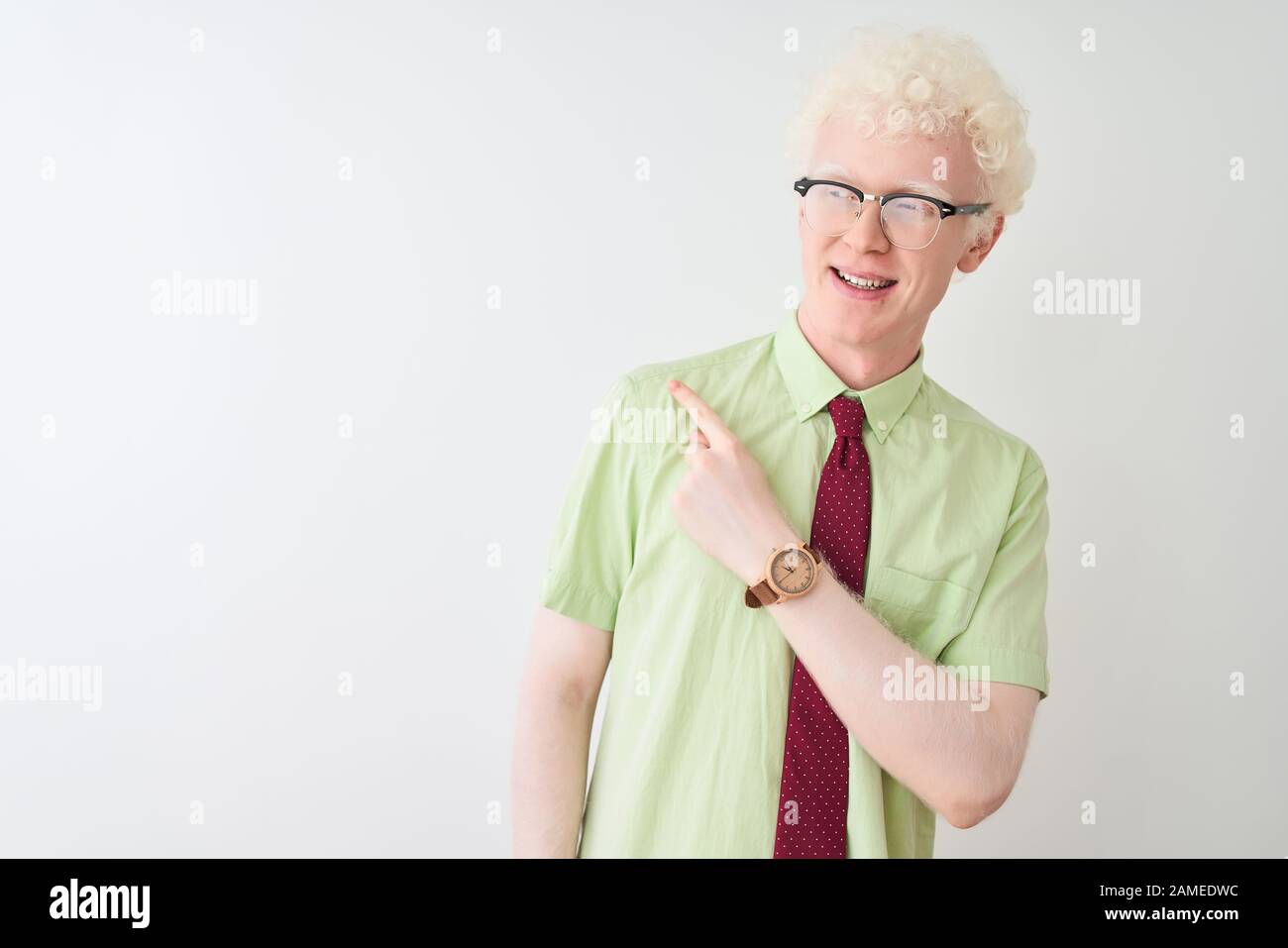 Young albino businessman wearing shirt and tie standing over isolated ...
