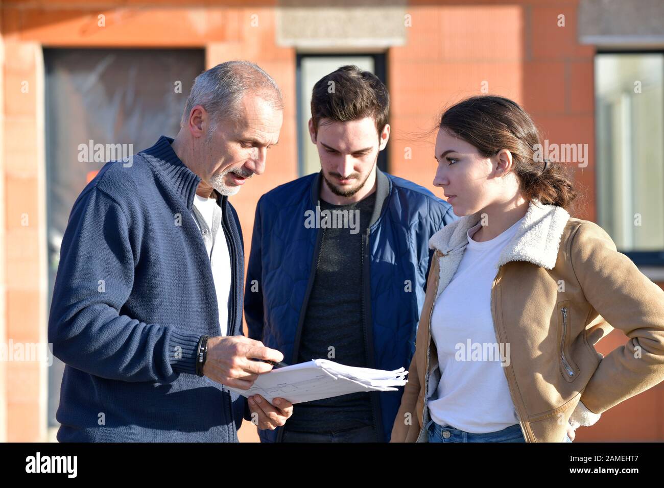 Young couple visiting house under construction Stock Photo - Alamy