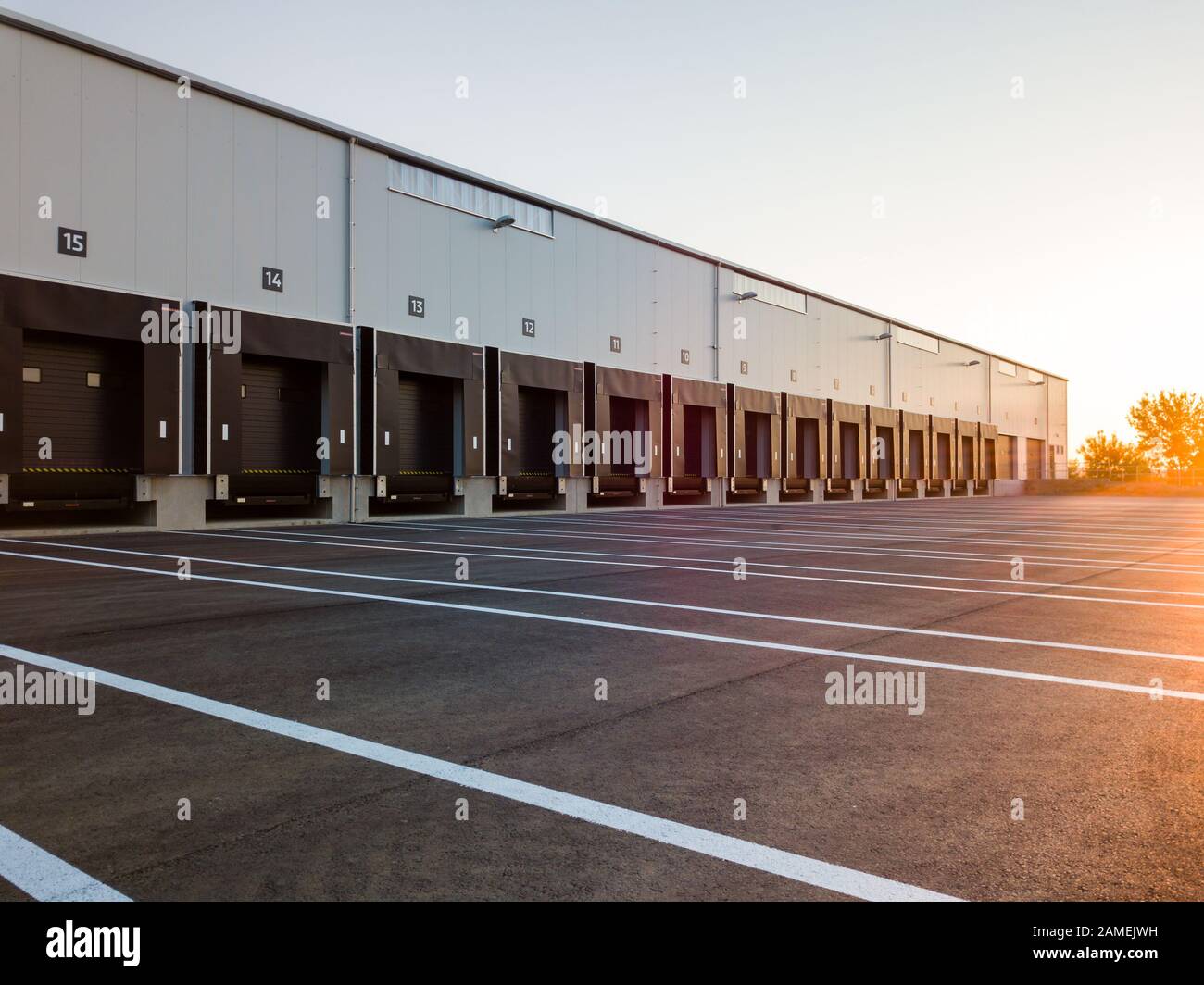 Warehouse exterior with loading ramps and slots for trucks to park ...