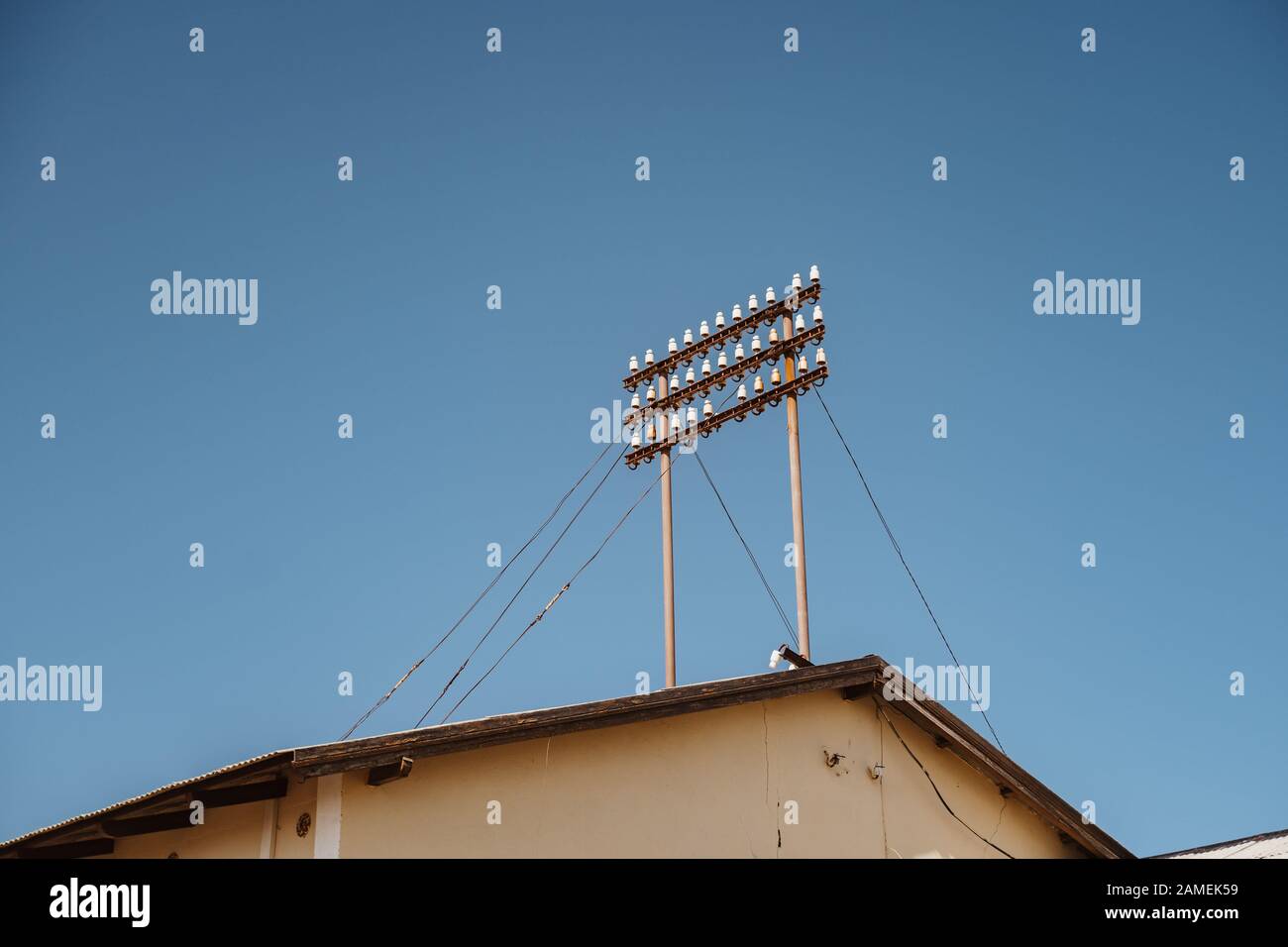 Roof top of old building with historic power poles Stock Photo - Alamy