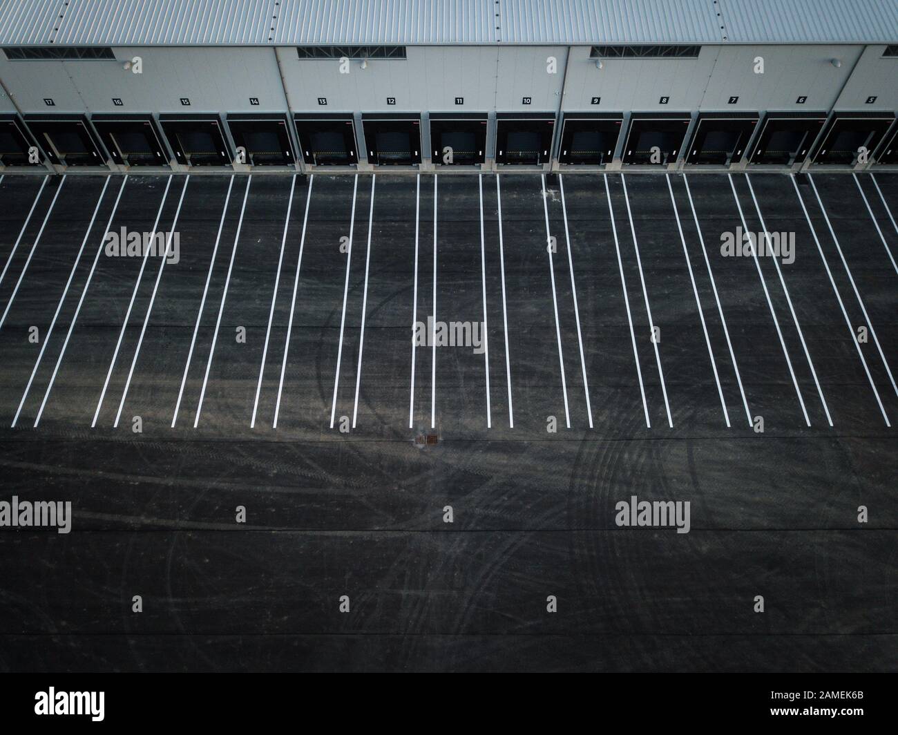 Warehouse exterior with loading ramps and slots for trucks to park ...