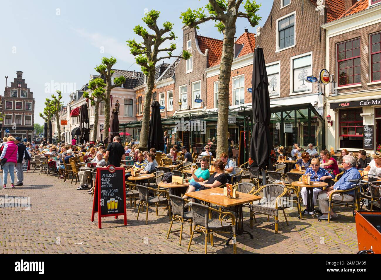 Haarlem, Netherlands - May 28 2019: People enjoy drinks at the tables ...