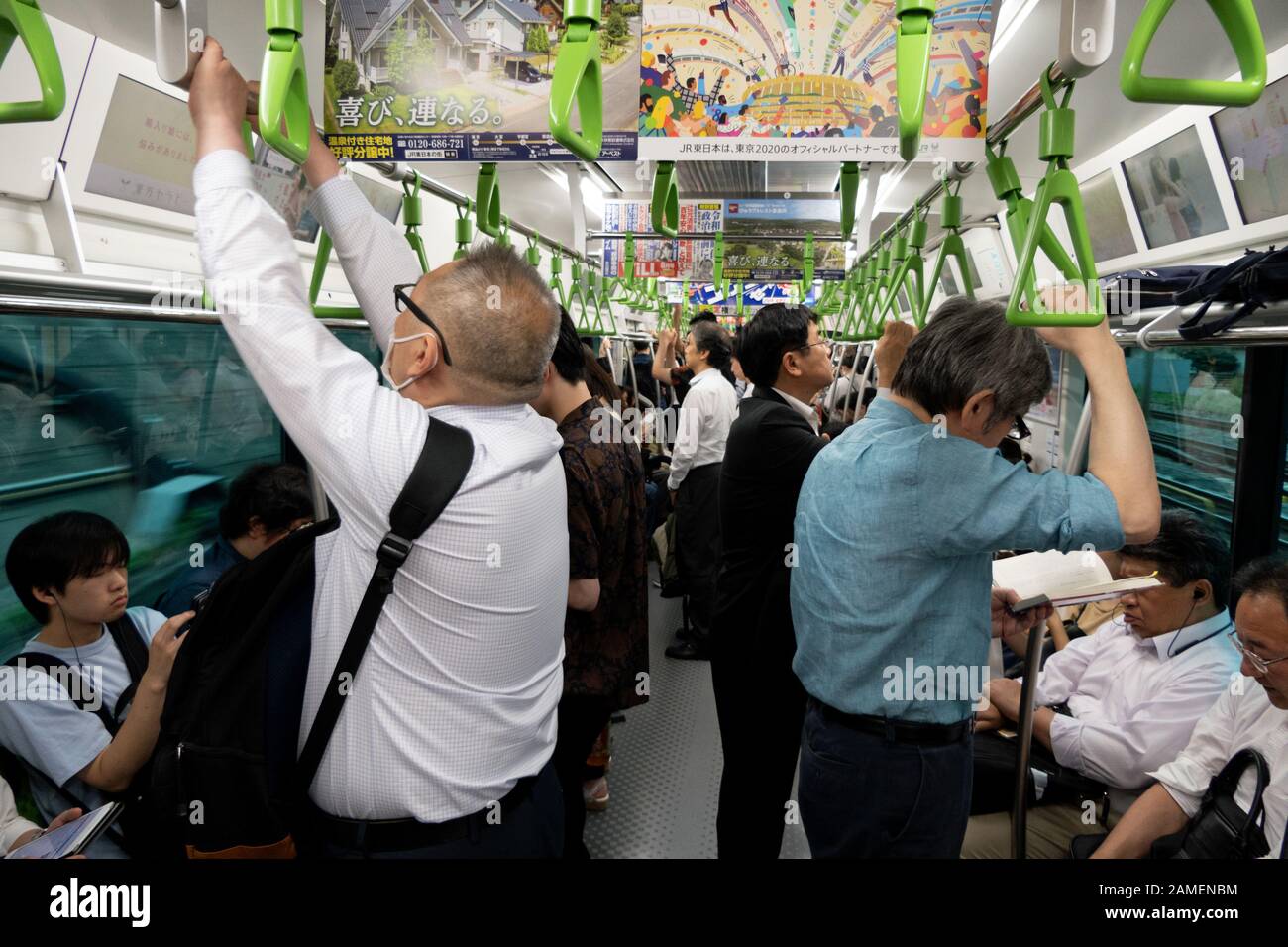 Japanese people commuting on local train in Tokyo, Japan, Asia. Asian ...