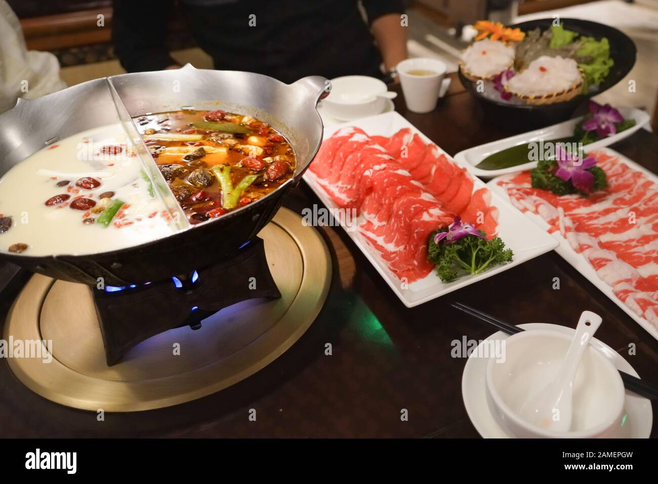 Chinese Hotpot shabu spicy and sour soup with meat and seafood, Suki ...