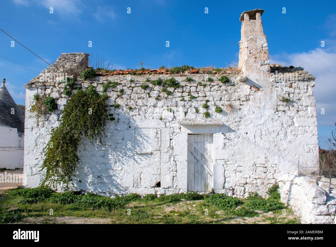 Ancient old white stone house in a countryside village in Puglia, Italy ...