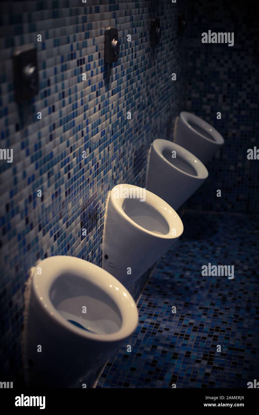 Color image of a men's public toilet Stock Photo - Alamy