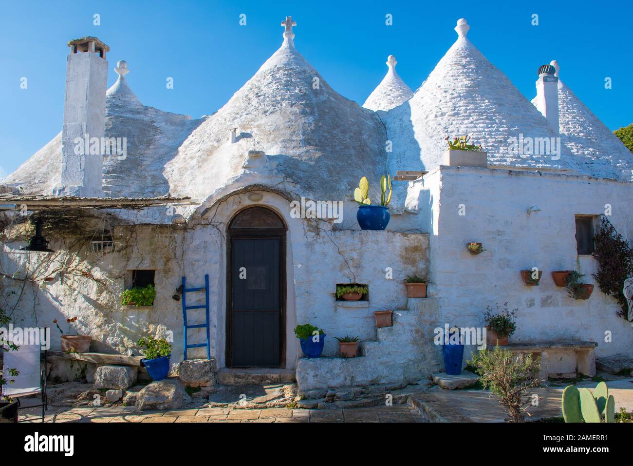 Group of Trulli house with garden, traditional old houses and old stone ...