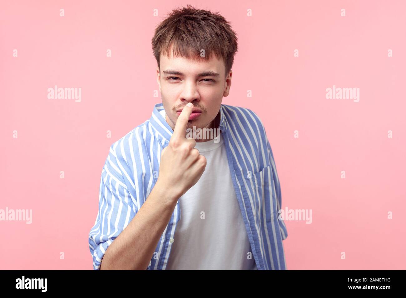 You are liar. Portrait of young brown-haired man with incredulous ...