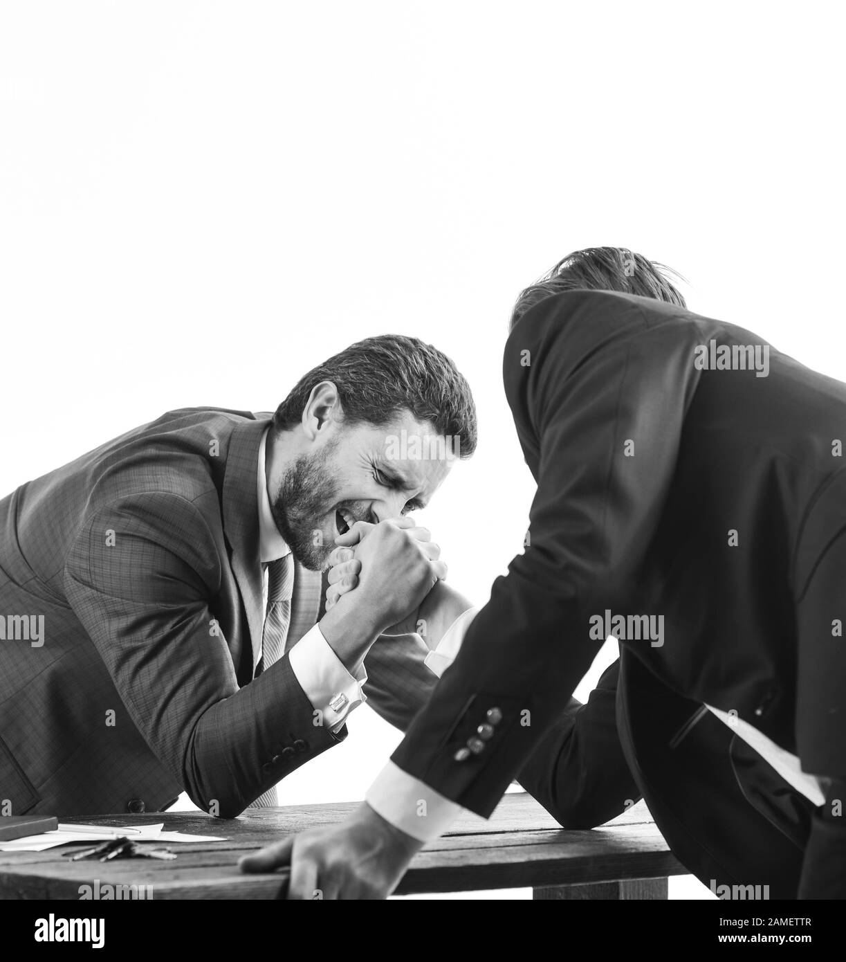 Men in suit or businessmen with screaming face compete in armwrestling ...