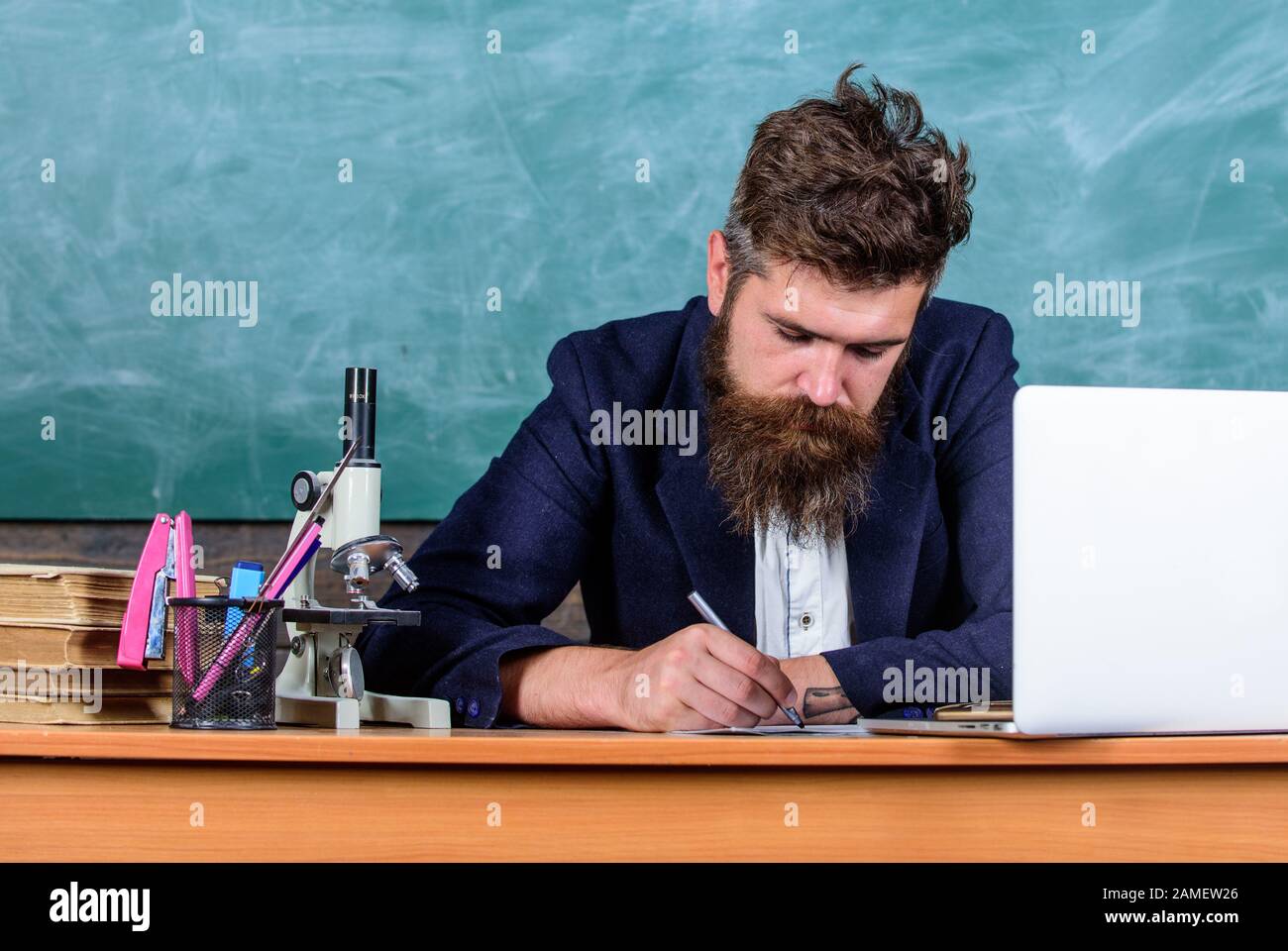 School paperwork. Paperwork part of teachers life. Teacher sit desk ...
