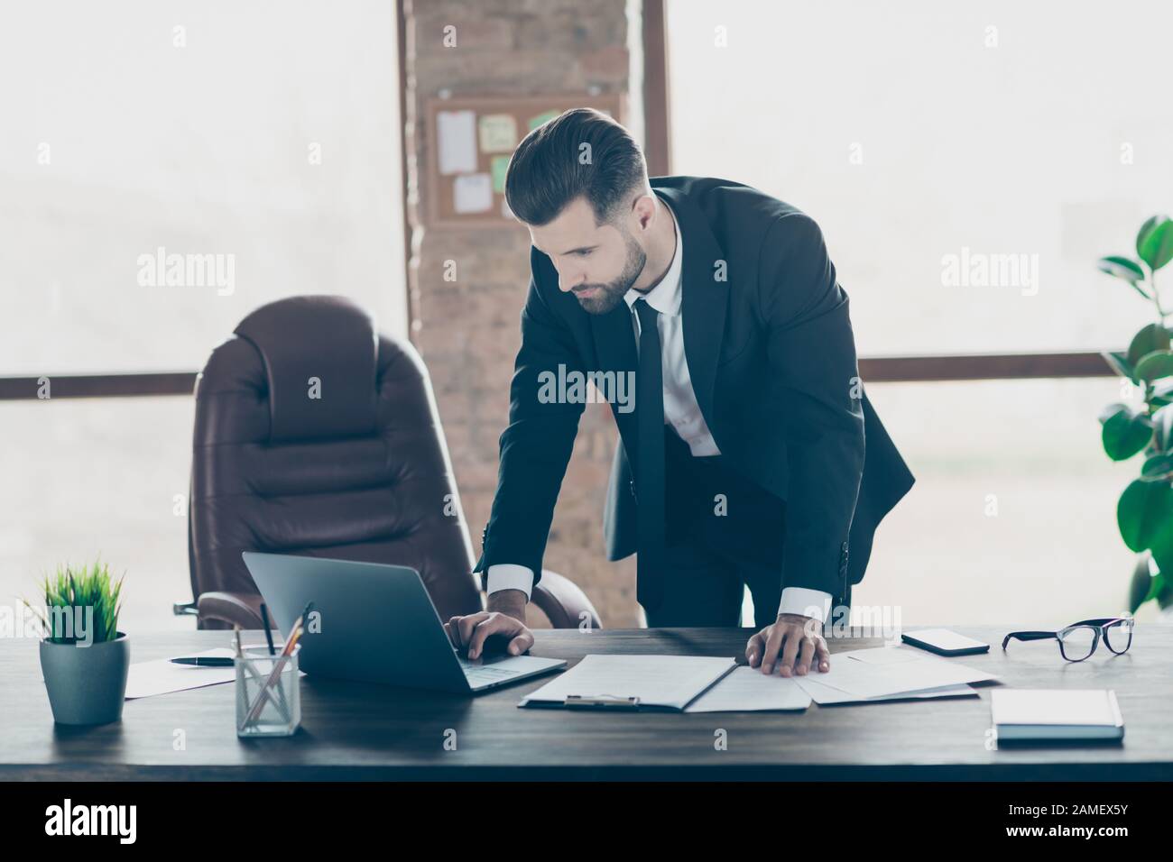 Photo of handsome successful business guy typing notebook keyboard ...