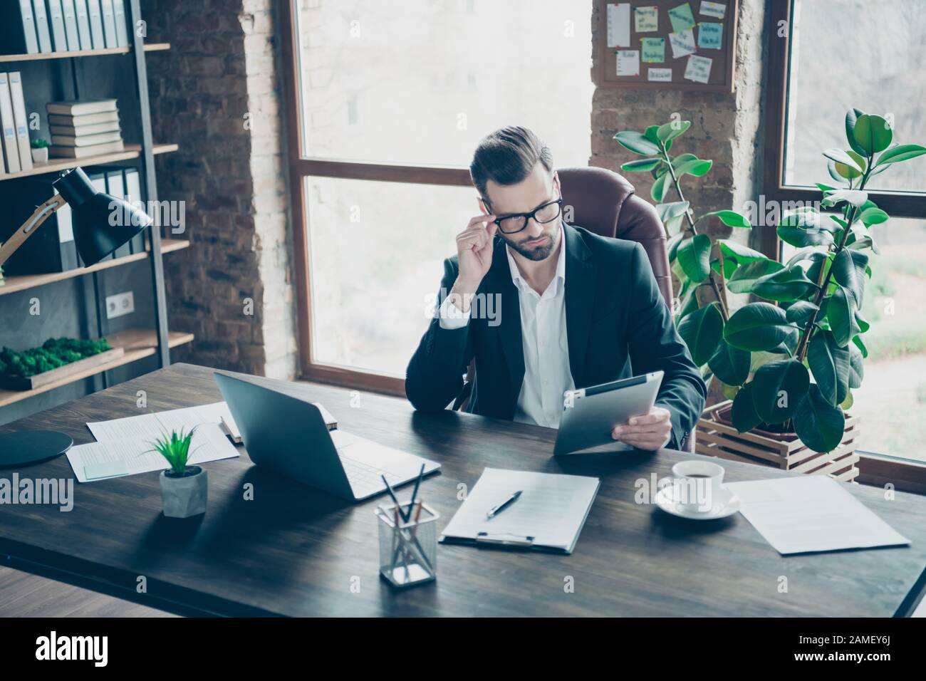 Male boss checking report on hi-res stock photography and images - Alamy