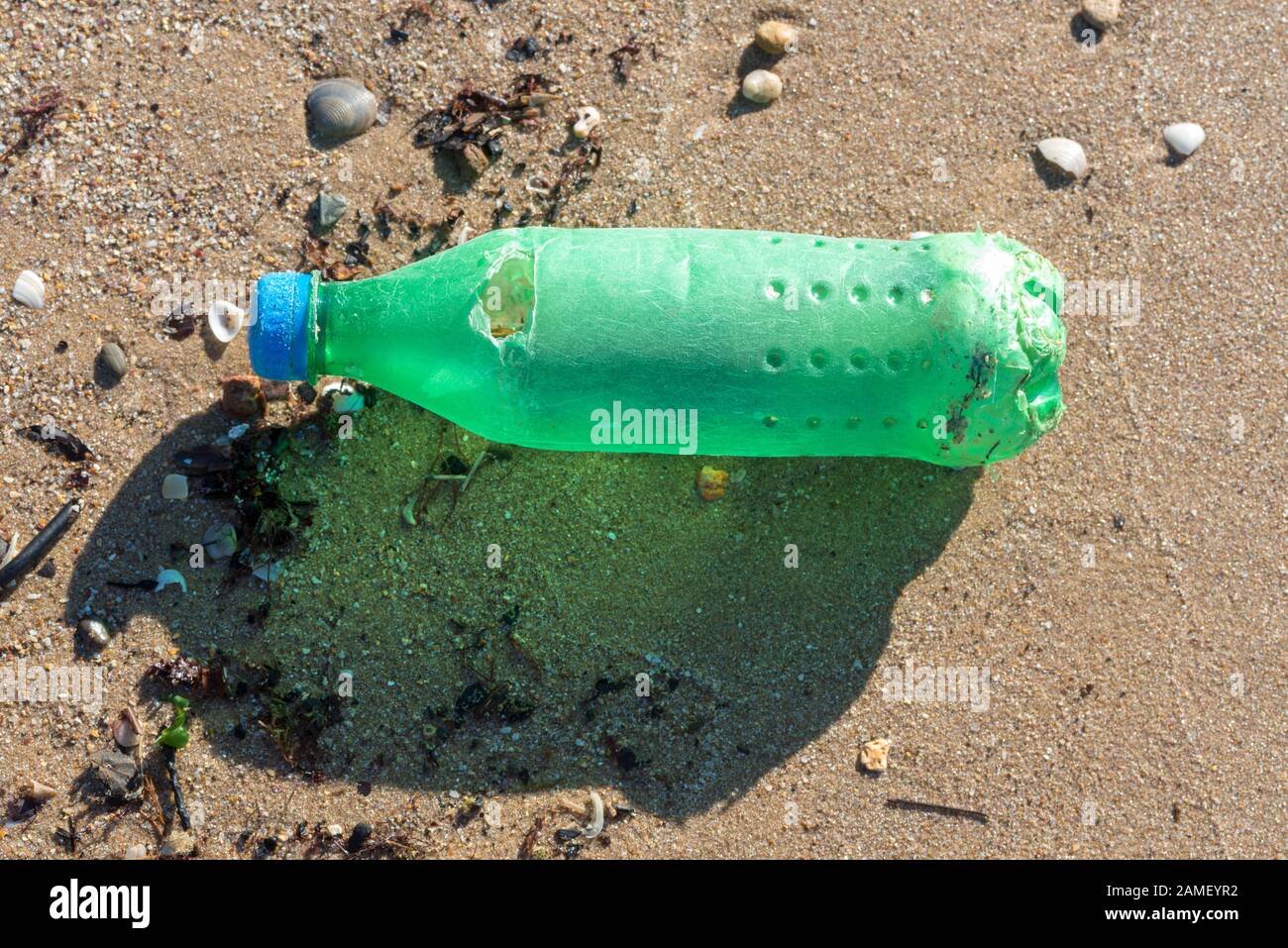 Plastic trashes on the beautiful sandy beach Stock Photo - Alamy