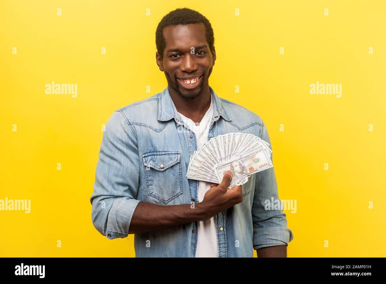 Happy businessman holding lots money hi-res stock photography and ...