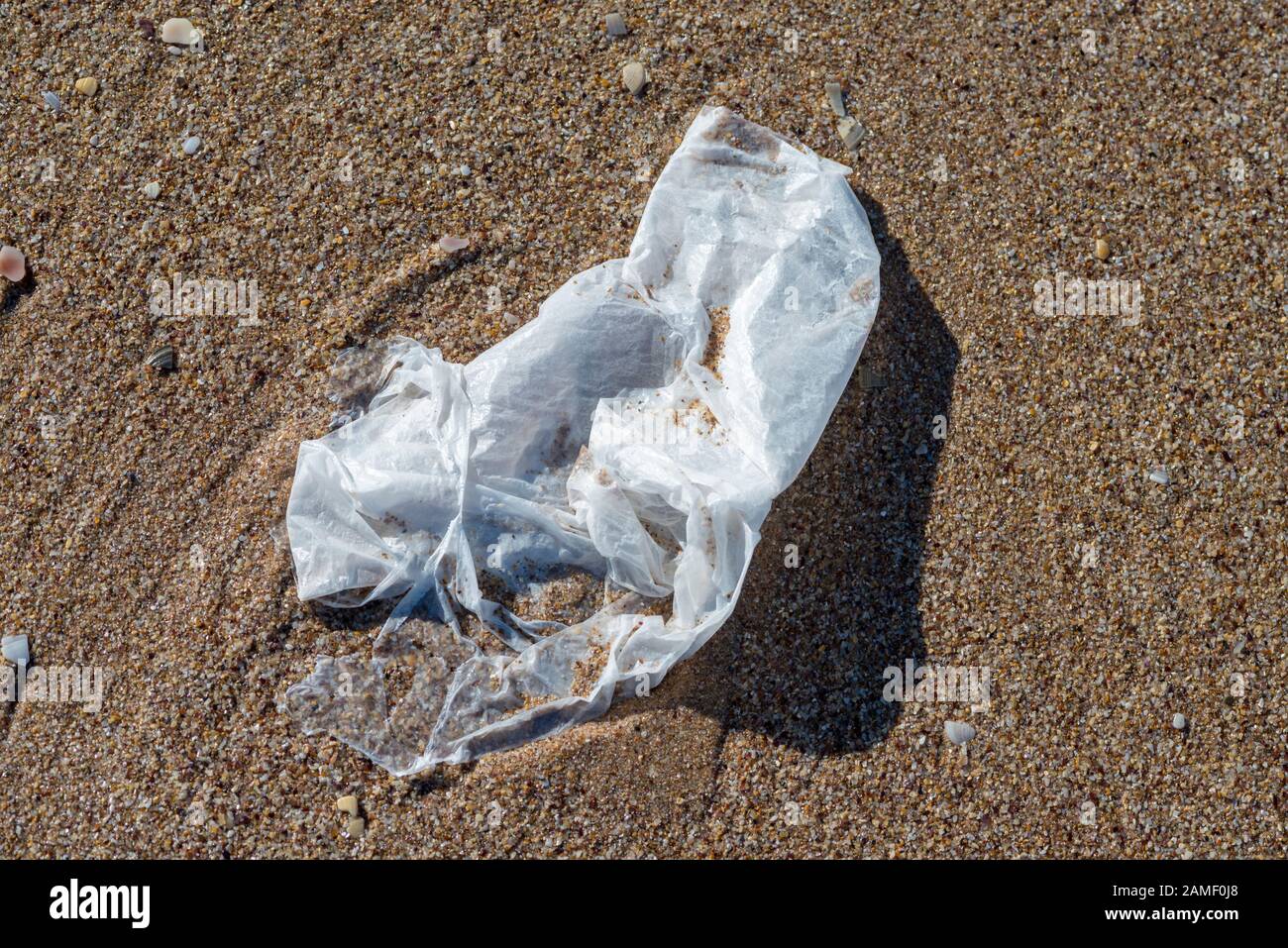 Plastic trashes on the beautiful sandy beach Stock Photo - Alamy