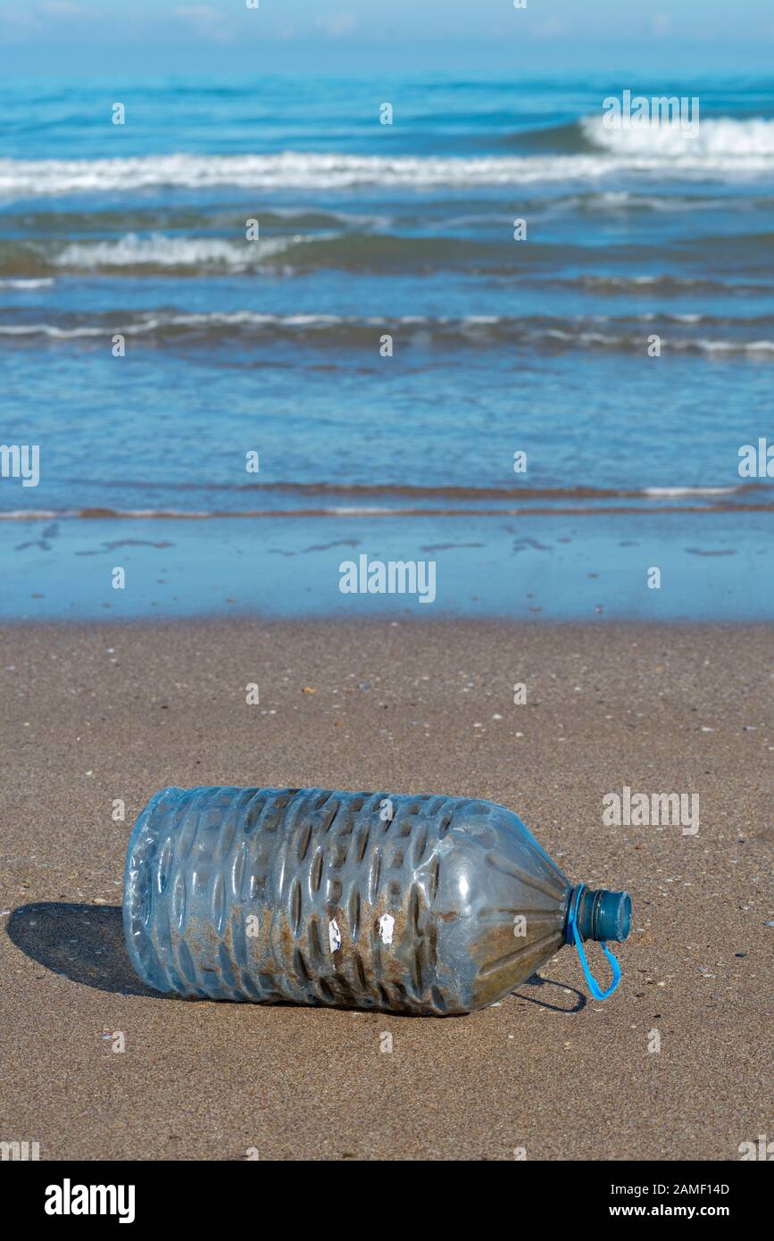 Plastic trashes on the beautiful sandy beach Stock Photo - Alamy
