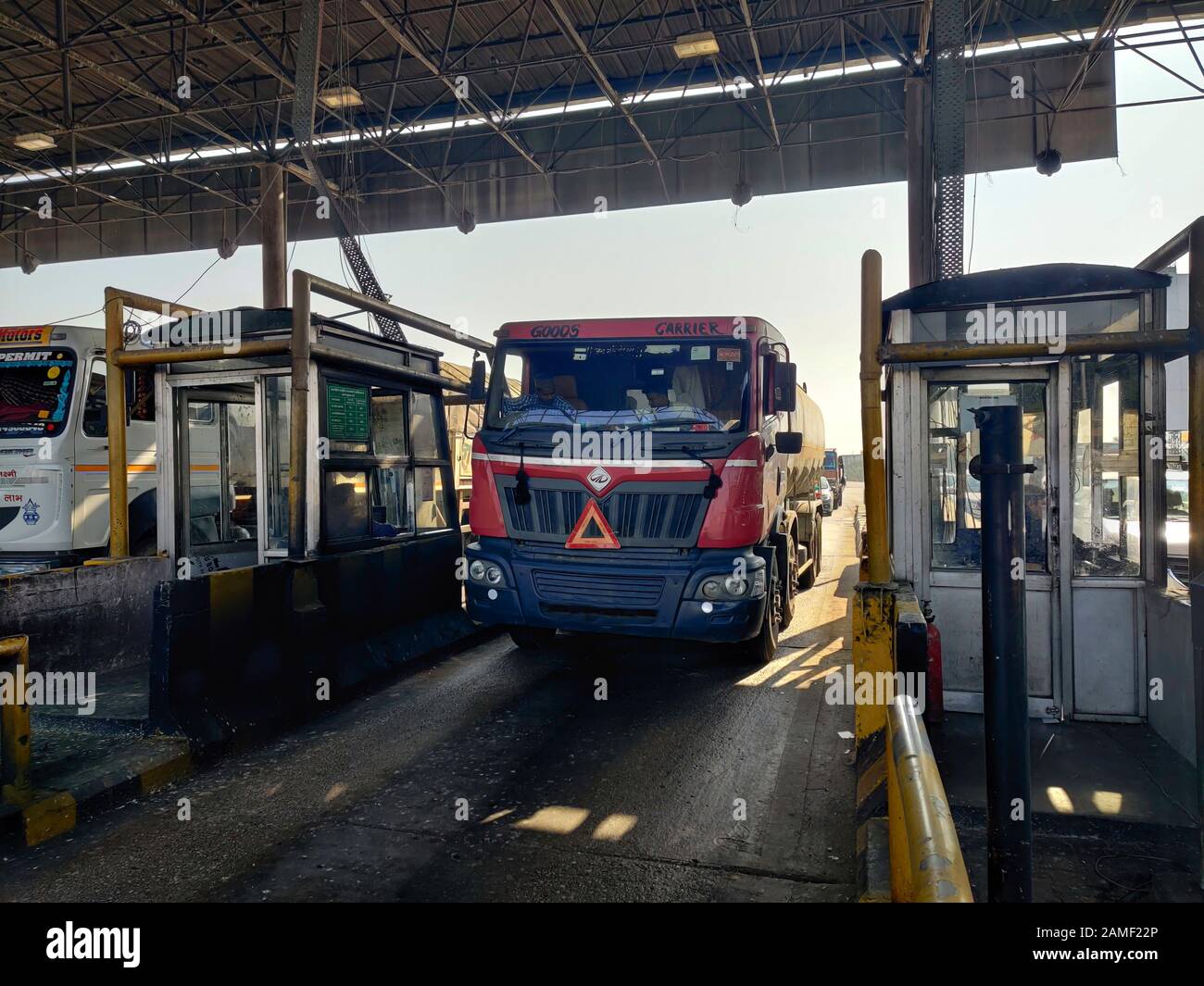 Truck with a FASTag standing on a toll booth Stock Photo - Alamy