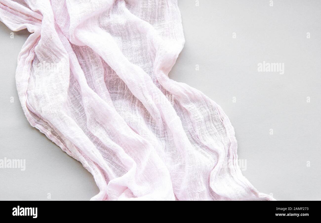 Pink scarf folded on white background. Flat lay Stock Photo - Alamy